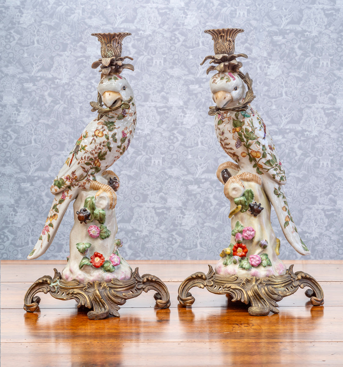 SOLD A very pretty pair of painted porcelain and gilt metal parrot can ...
