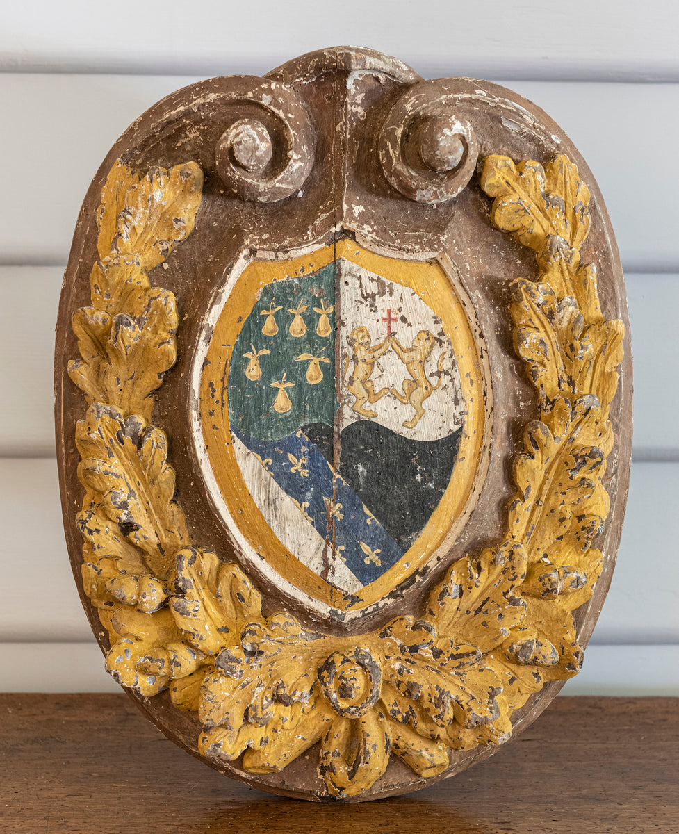 SOLD A decorative polychrome painted and carved heraldic sheild, Itali ...